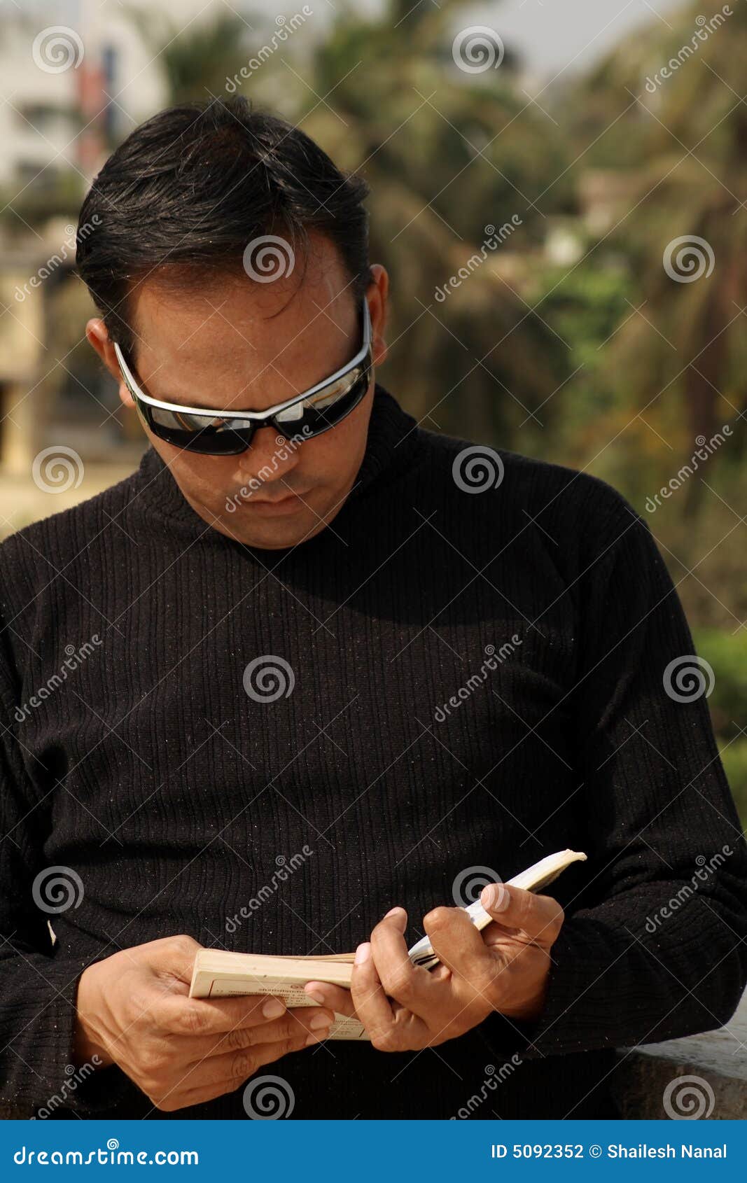 Engrossed in the Book stock photo. Image of handsome, expressive - 5092352