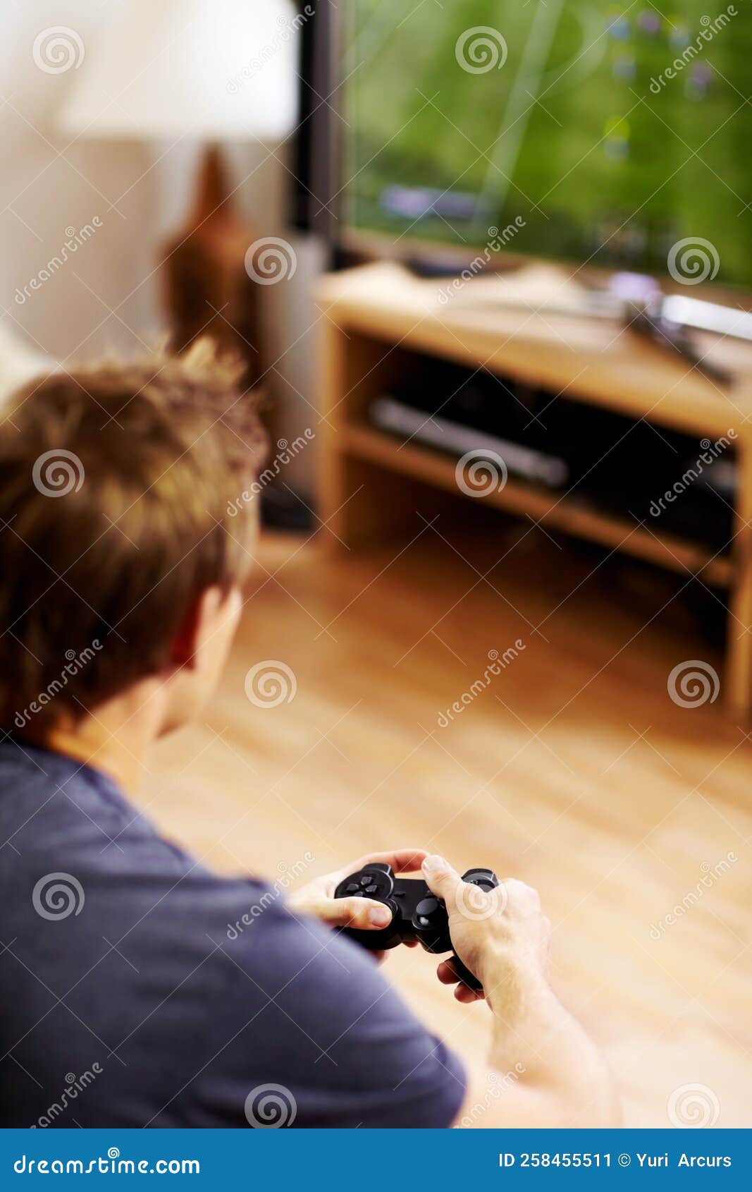 Engrossed in the Game. Handsome Guy Playing a Video Game Using a ...