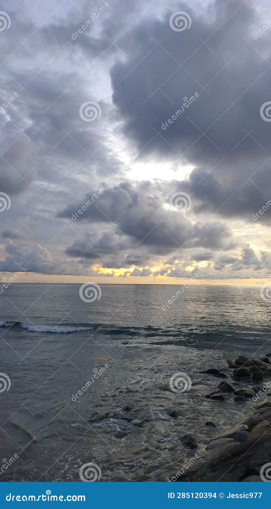 Enjoy a Beautiful Sunset Under the Clouds on the Beach Stock Photo - Image of beautiful, sunset ...