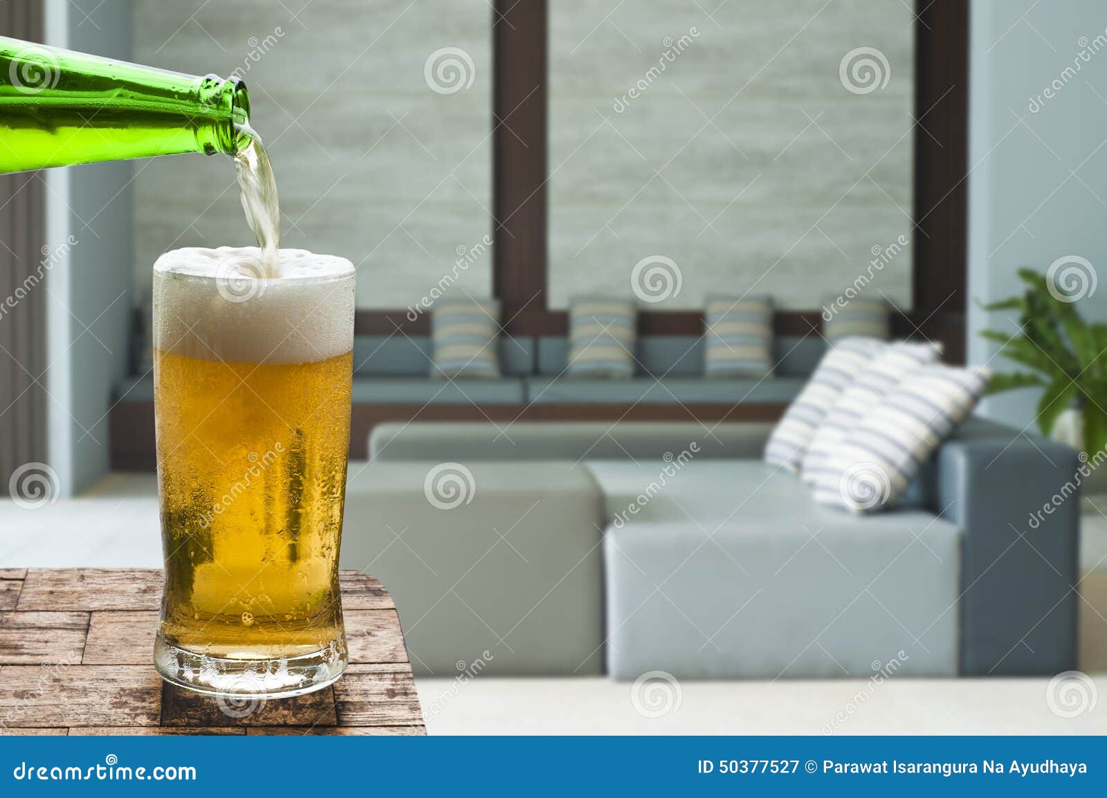 Enjoy beer in living room. stock image. Image of glass - 50377527