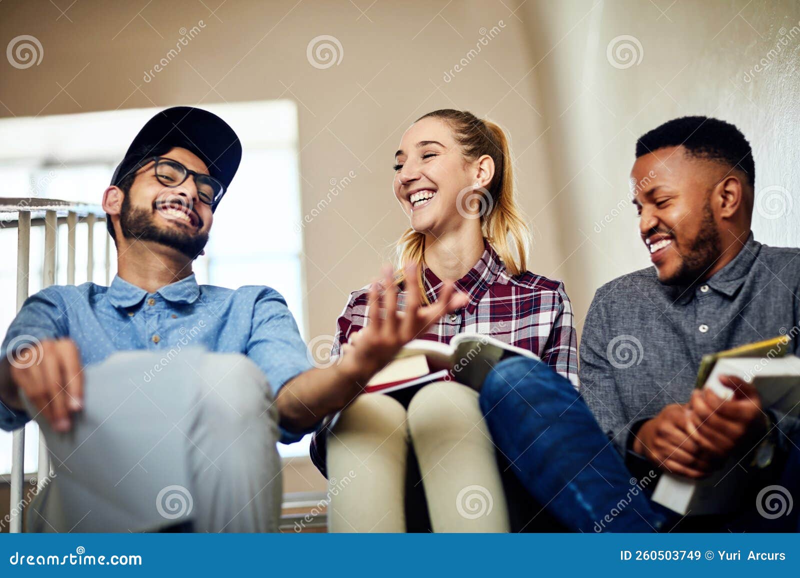 They Enjoy Studying Together. Three Young University Students Studying ...