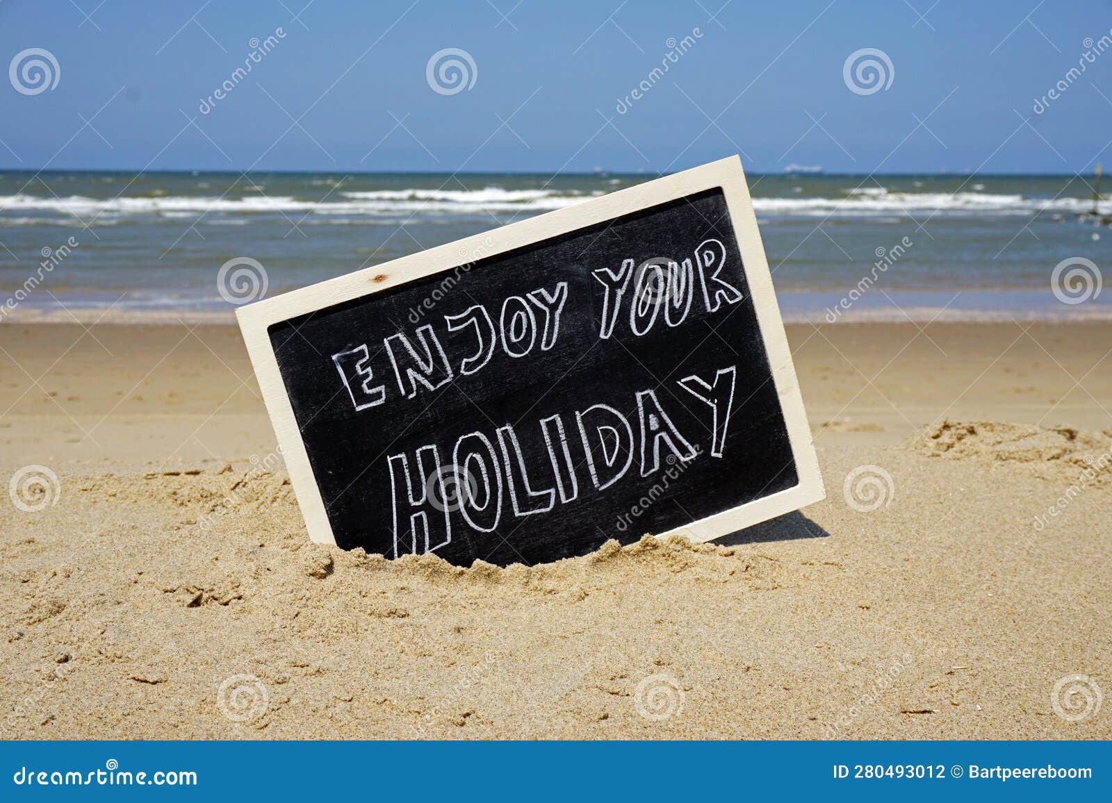 Enjoy your holiday written stock photo. Image of board - 280493012