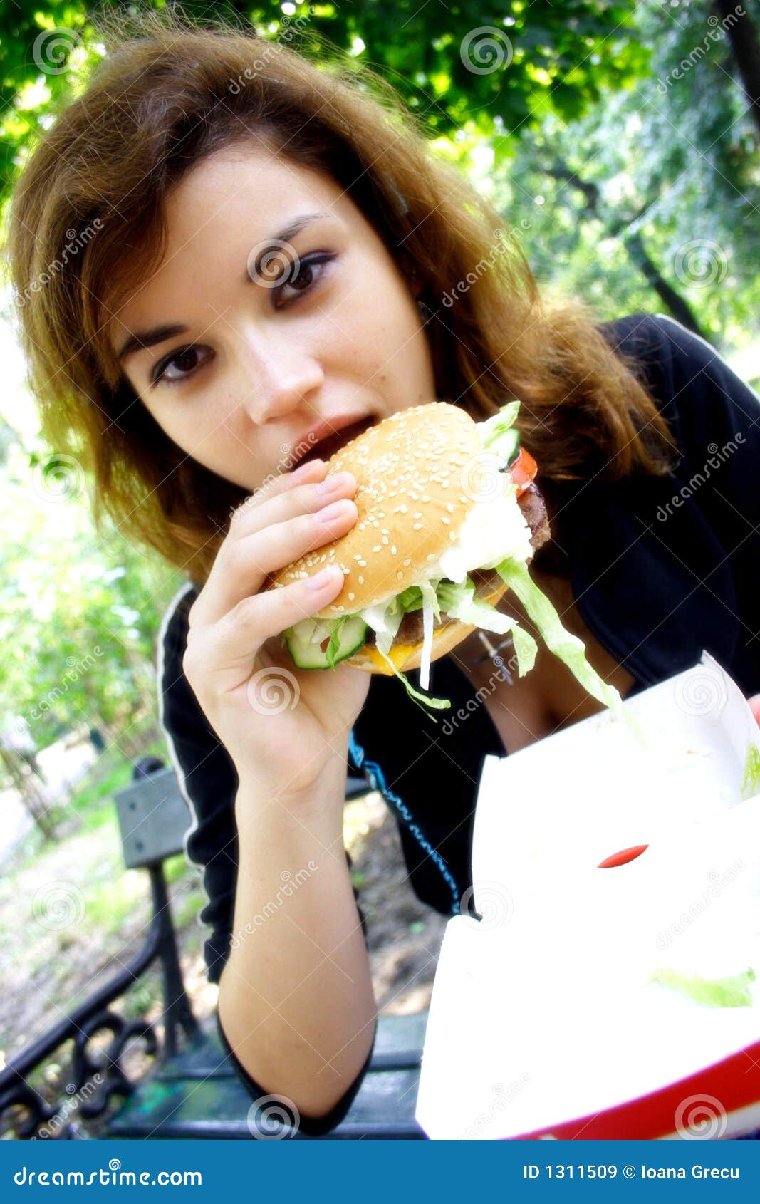 Enjoying eating Fast food stock image. Image of junk, restaurant - 1311509