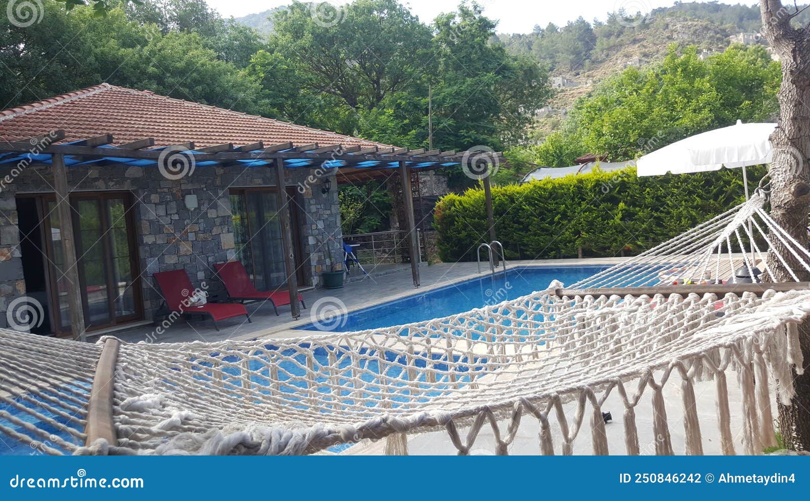 Enjoying a Hammock in a House with a Pool. Stock Photo - Image of house ...