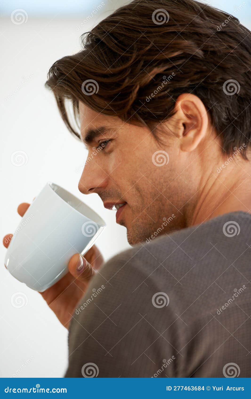 Enjoying His Morning Java. a Handsome Young Man Standing at Home and ...