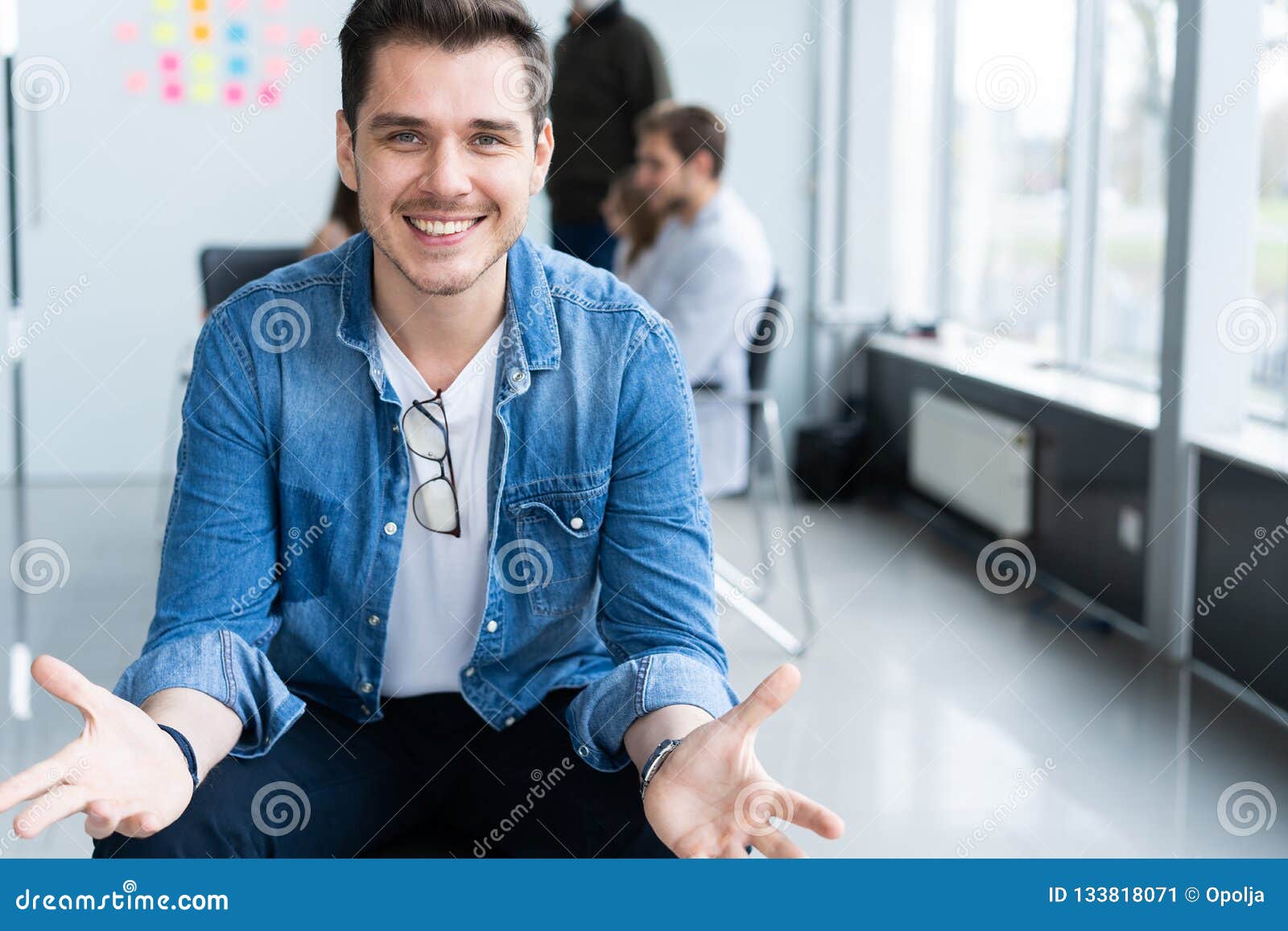 Enjoying His Work. Handsome Young Man Looking at Camera and Smiling ...