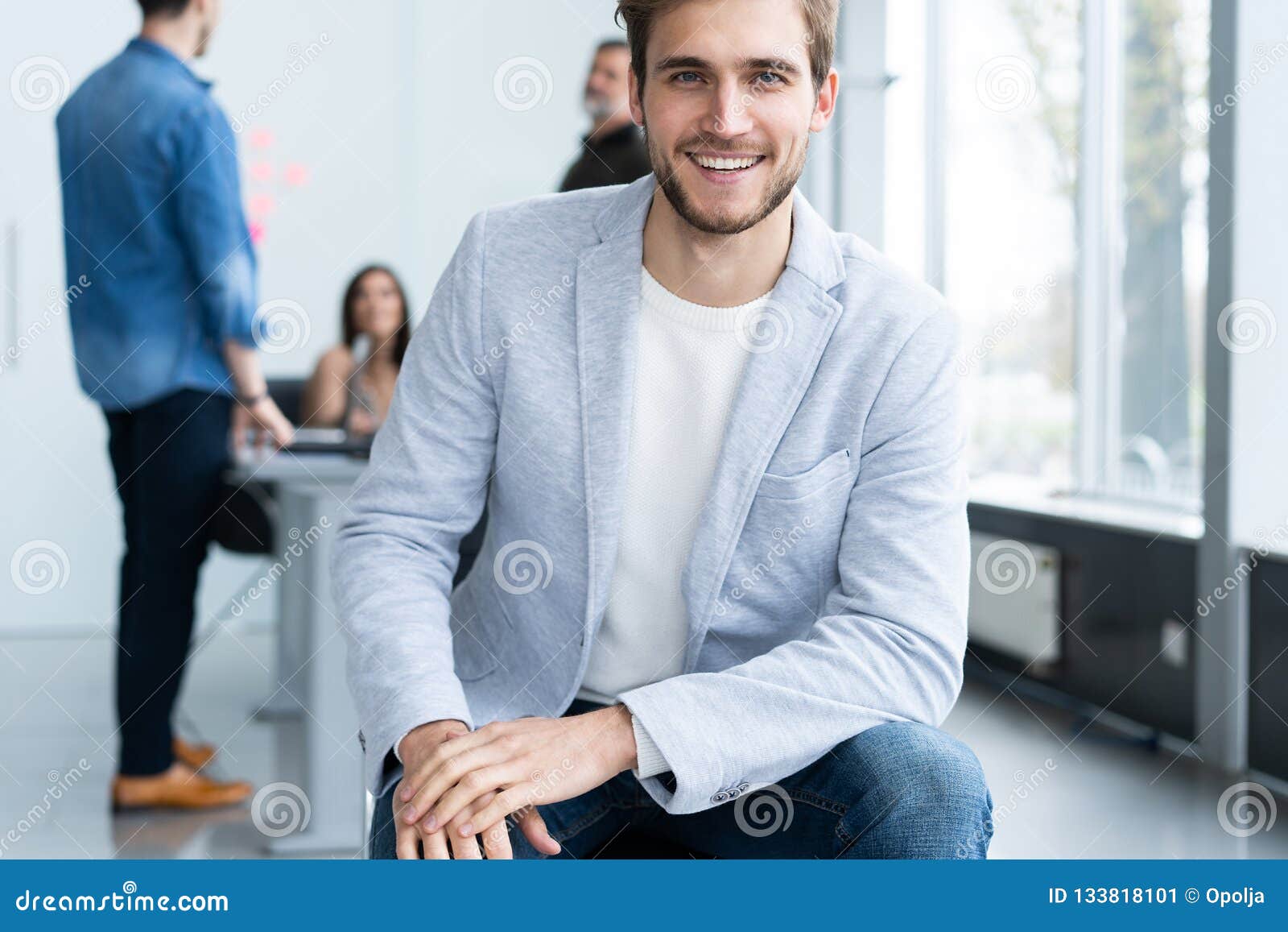 Enjoying His Work. Handsome Young Man Looking at Camera and Smiling ...