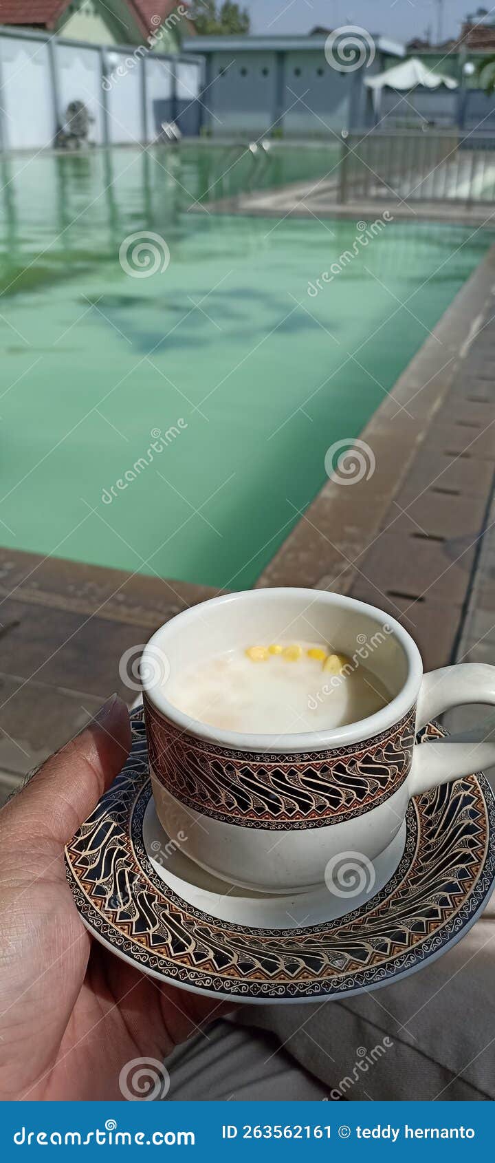 Enjoying Hot Milk with Corn in the Pool Side Stock Image - Image of ...