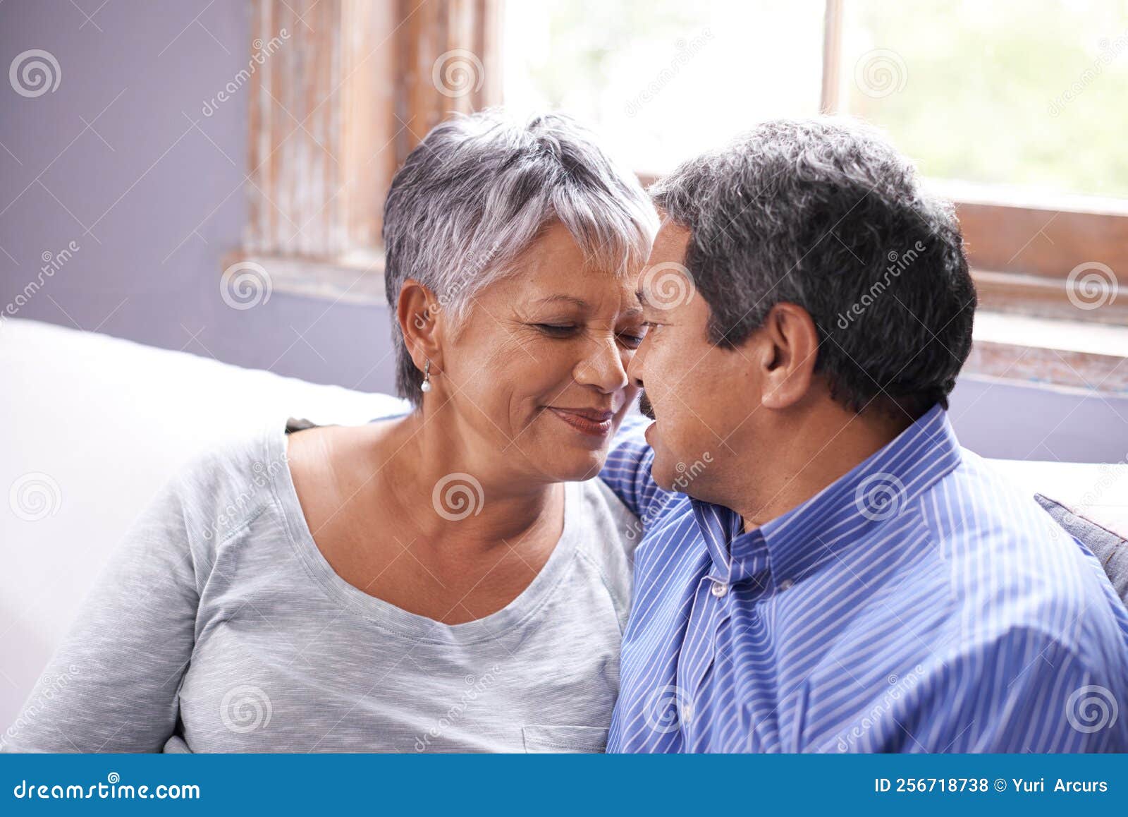 Enjoying The Moments They Share A Loving Mature Couple Sitting On