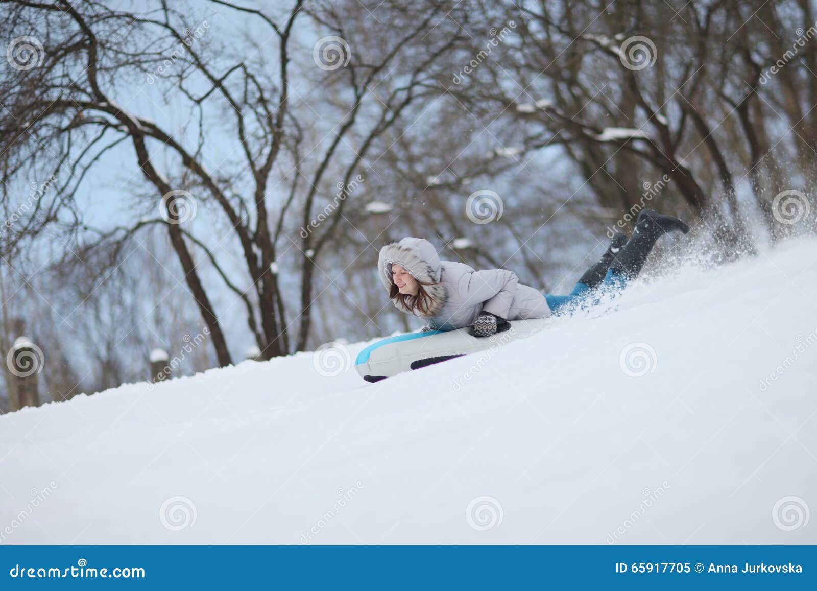 Enjoying winter sledding stock image. Image of cold, female - 65917705