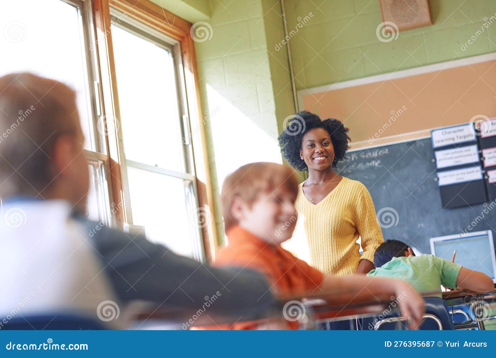 The Enjoys Her Job. a Young Teacher Educating a Group of Elementary ...