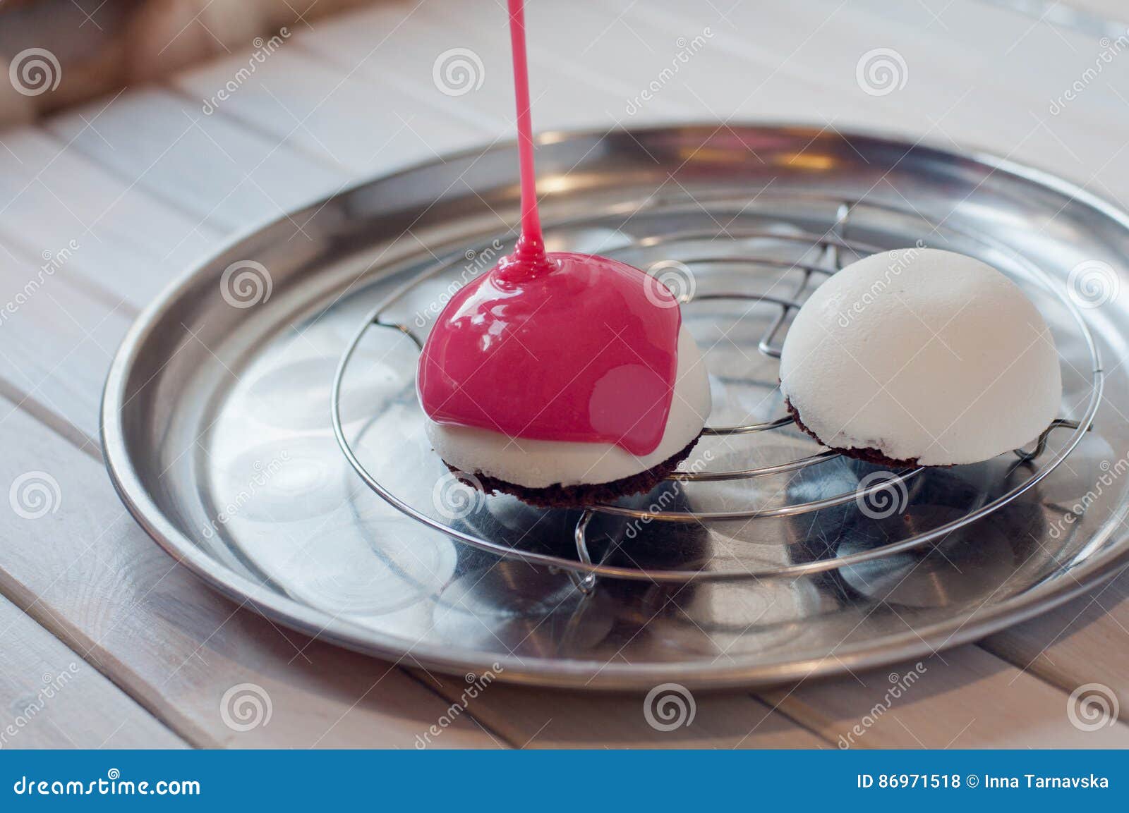 Enrobing Process. Two White Sphere Cakes and Rose Glaze Stock Photo ...