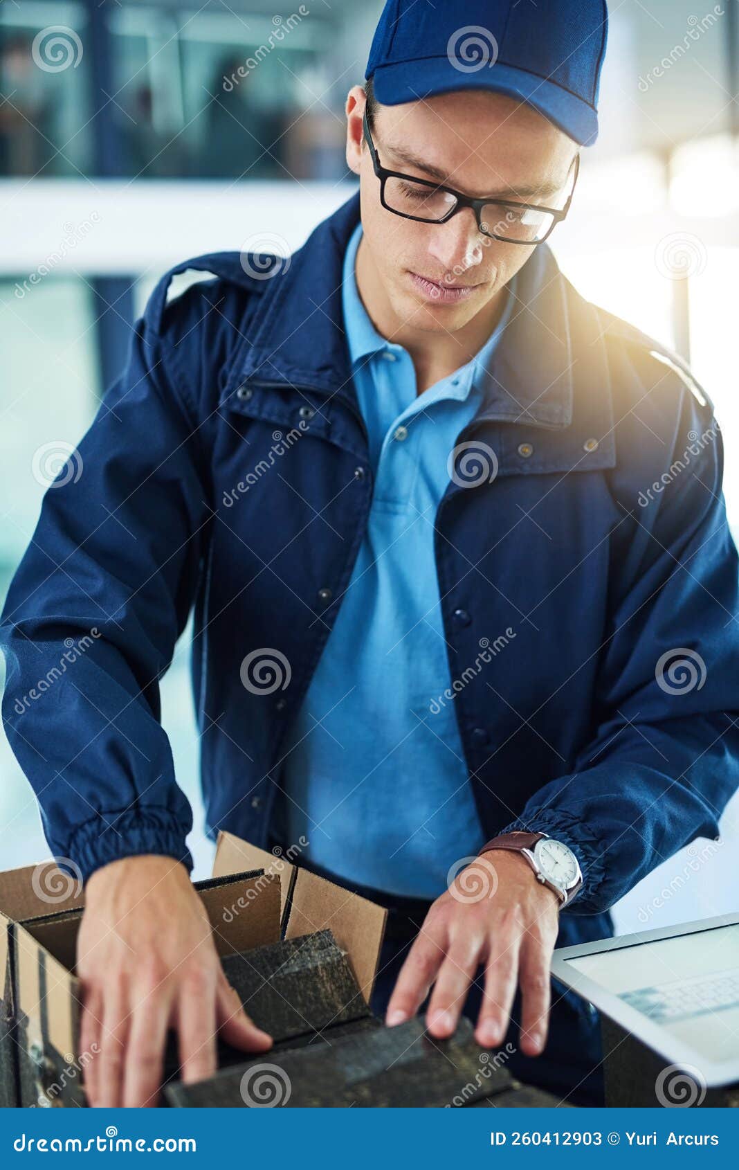 Ensuring All Boxes are Packaged According To Quality Standards. a ...