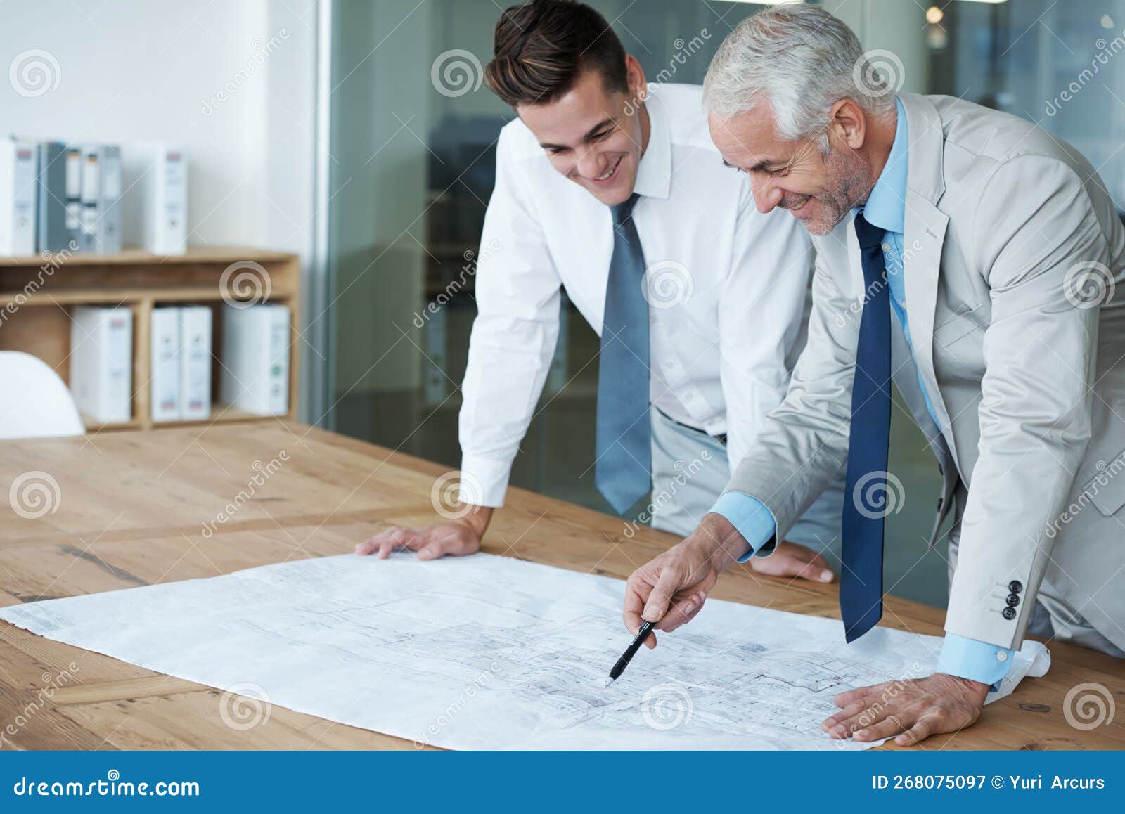 Ensuring the Blueprints are Perfect. Two Corporate Architects Going ...