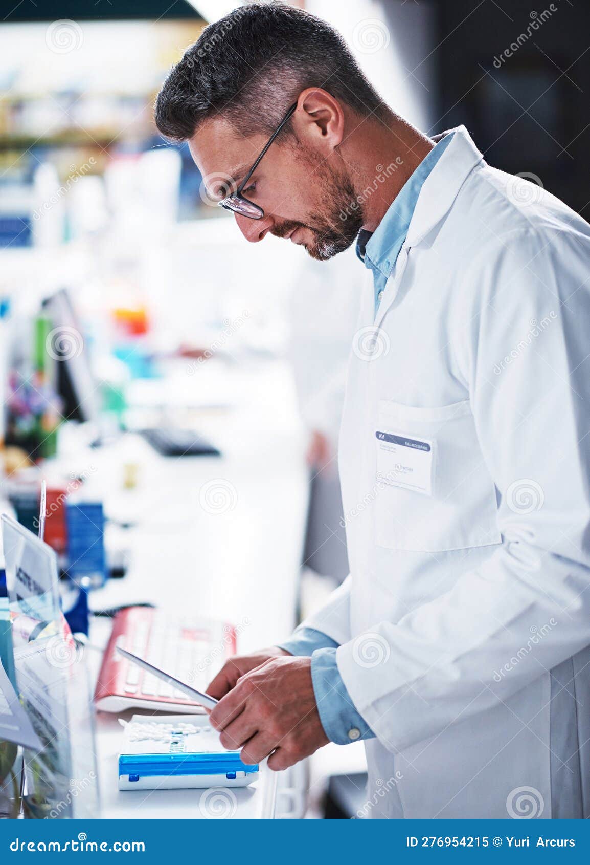 Ensuring You Get the Correct Dosage. a Mature Pharmacist Sorting ...