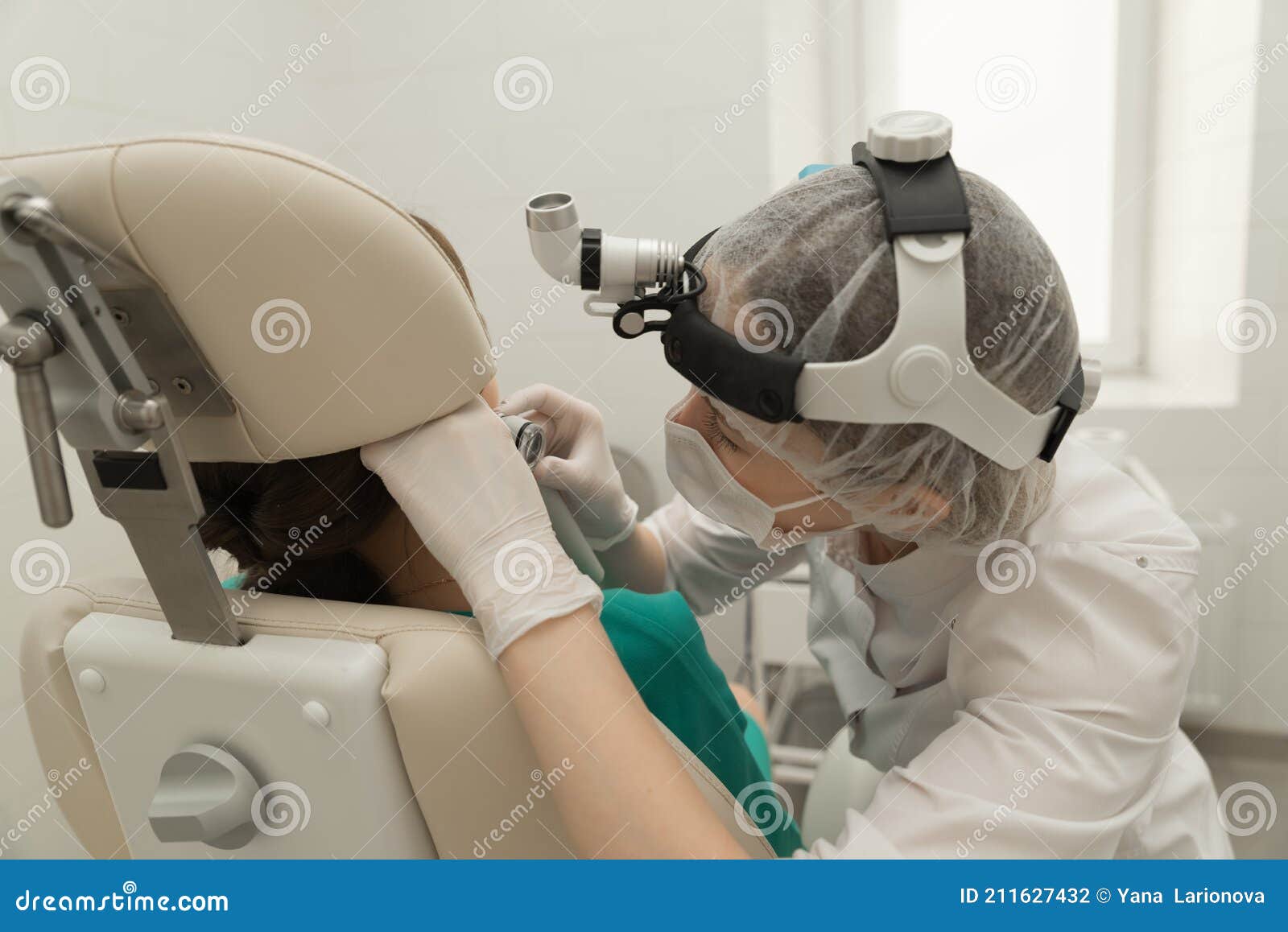 ENT Physician Looking into Patient S Ear with an Instrument Stock Photo ...