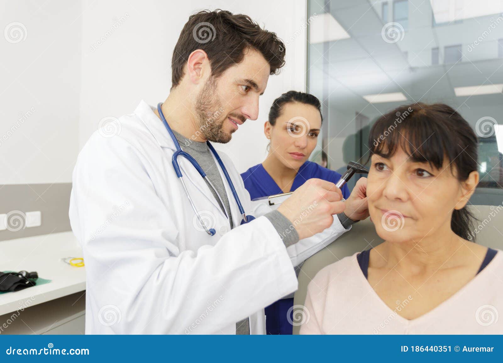 Ent Physician Looking into Patients Ear with Instrument Stock Image ...