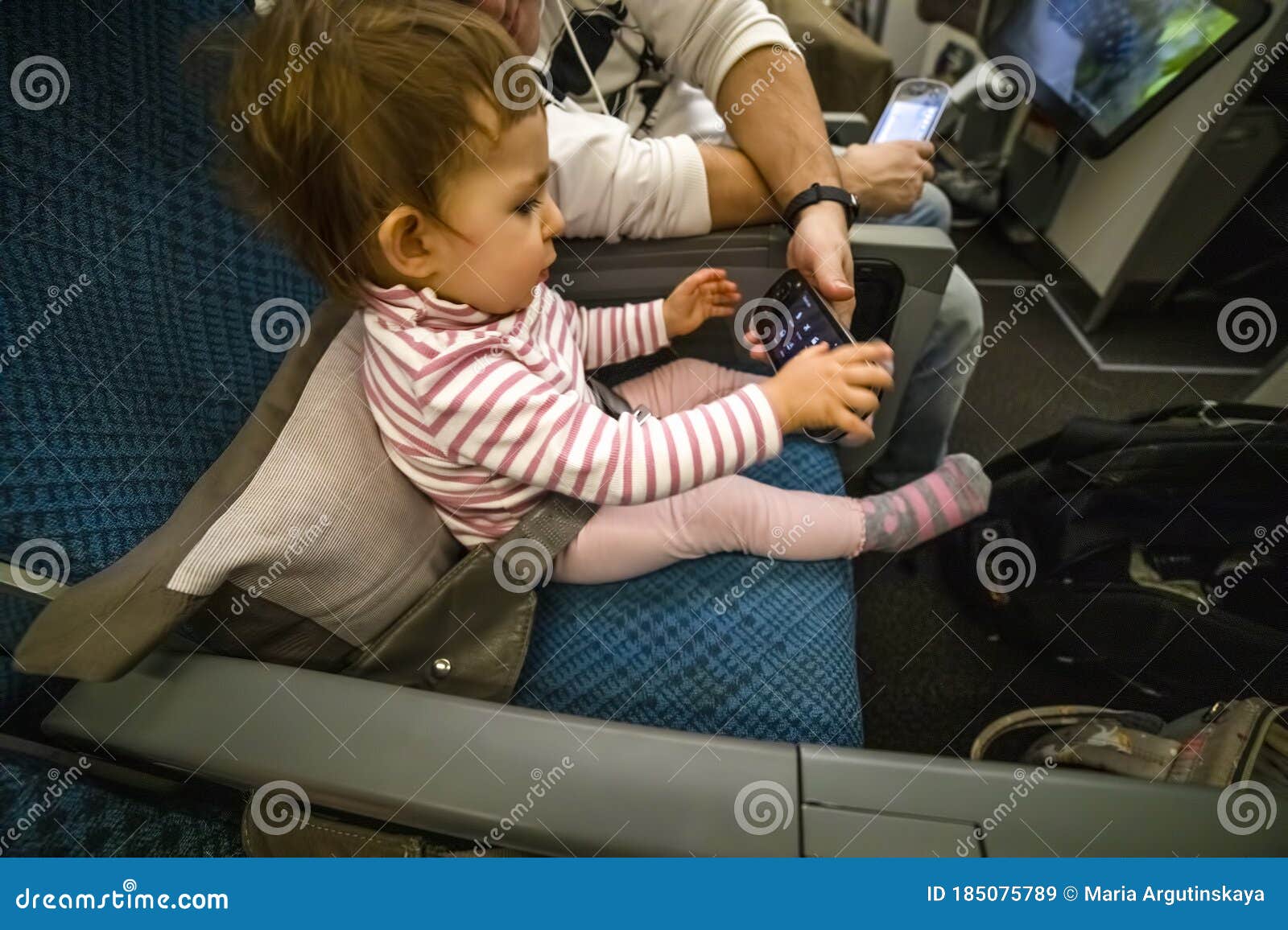 Entertainment on Board the Aircraft in Flight. Baby Sit on the Plane in ...
