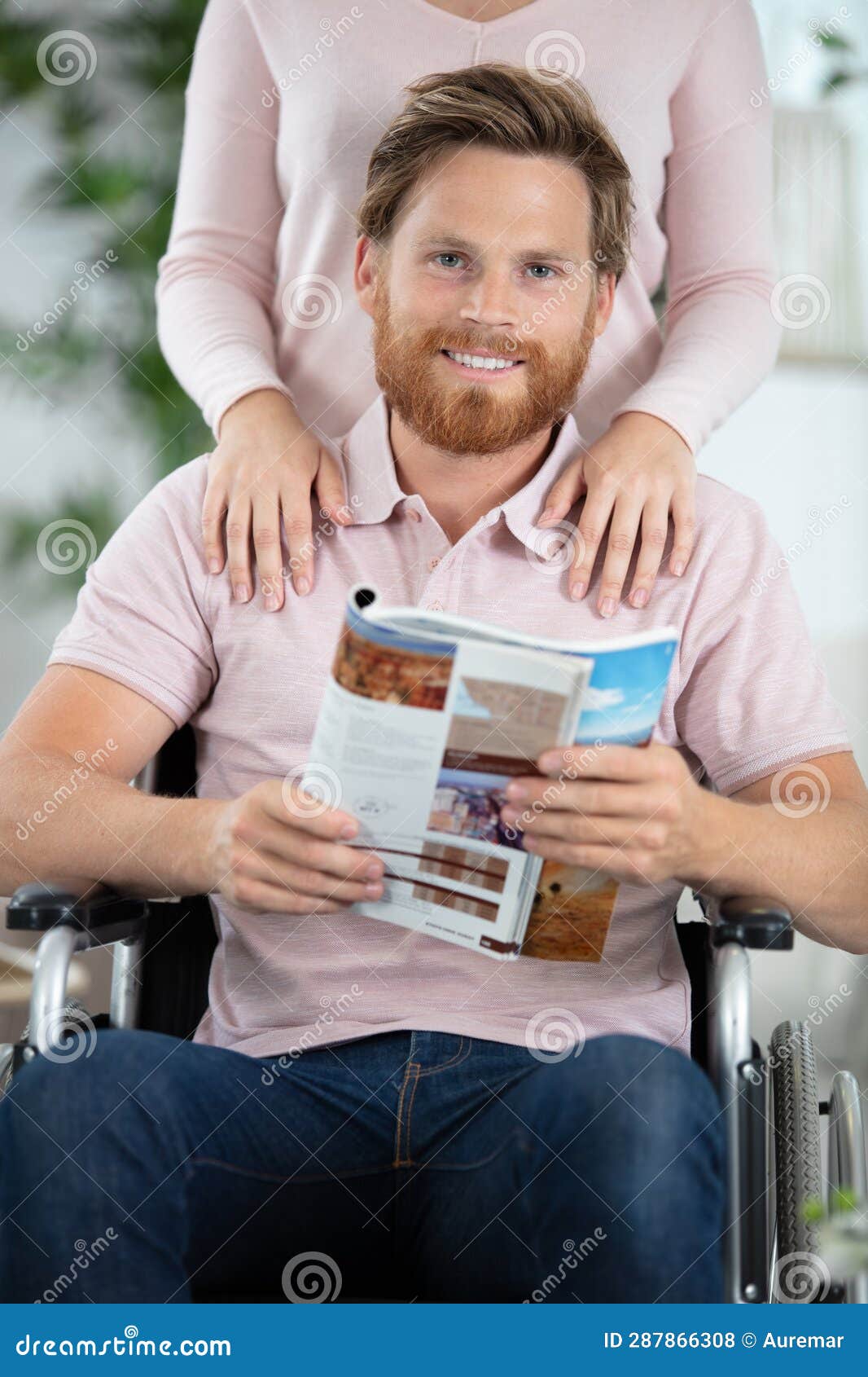Enthusiastic Handicapped Man Reading Magazine Stock Photo - Image of ...