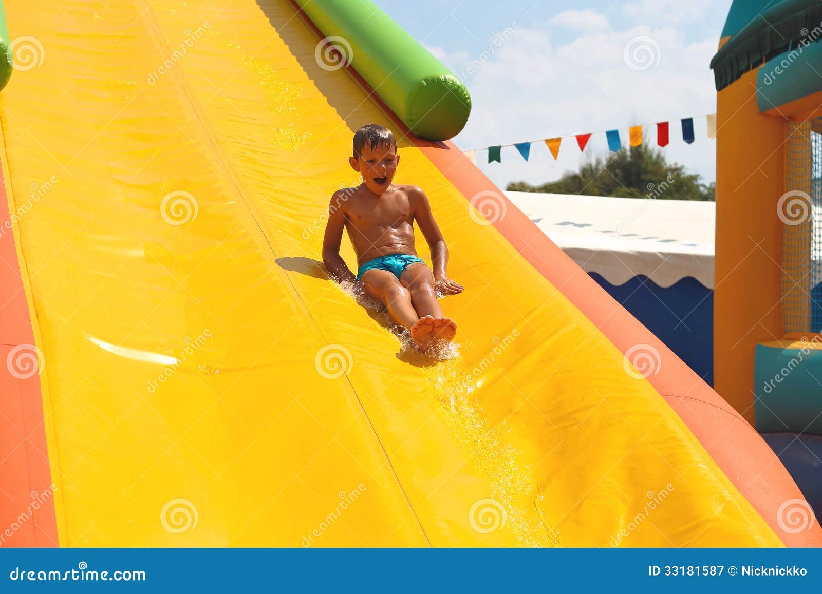 Enthusiastic kid on slide stock image. Image of blue - 33181587