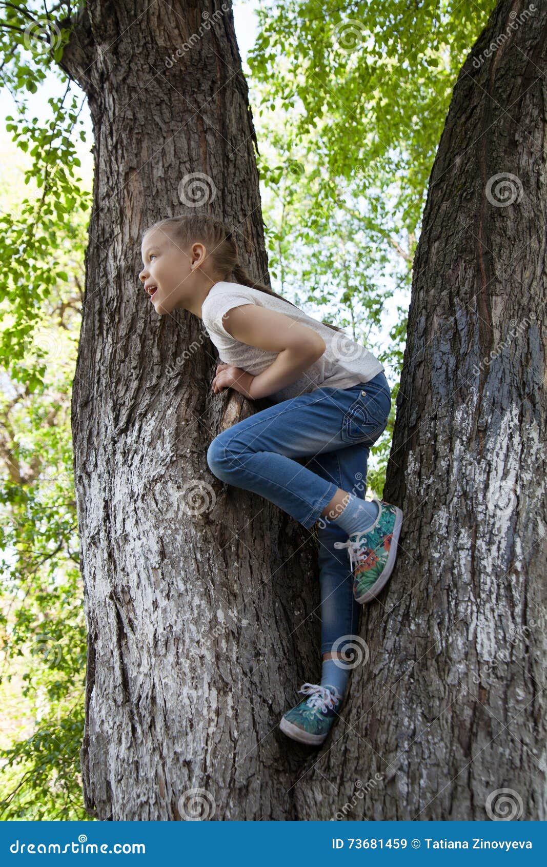 The Enthusiastic Little Girl Sitting on a Tree Stock Image - Image of ...