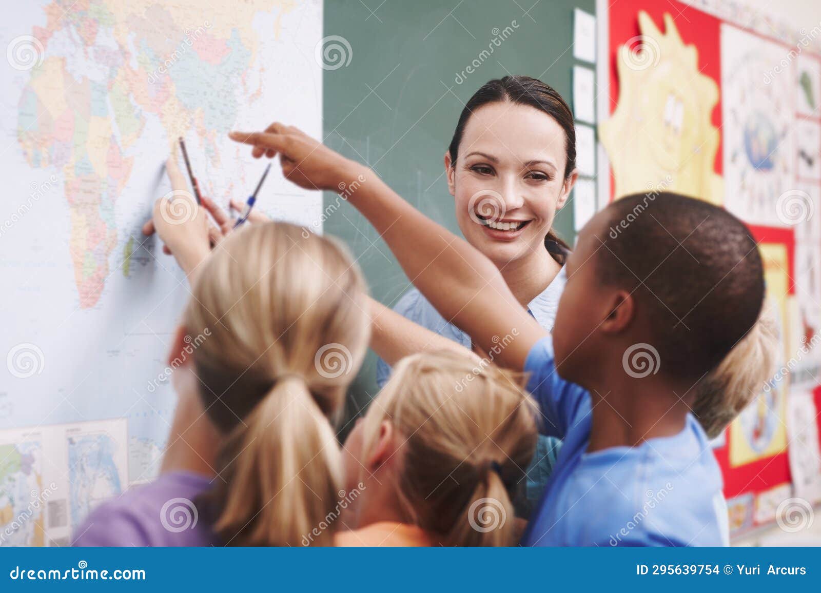 Enthusiastic about Teaching. an Excited Class Pointing at a World Map ...