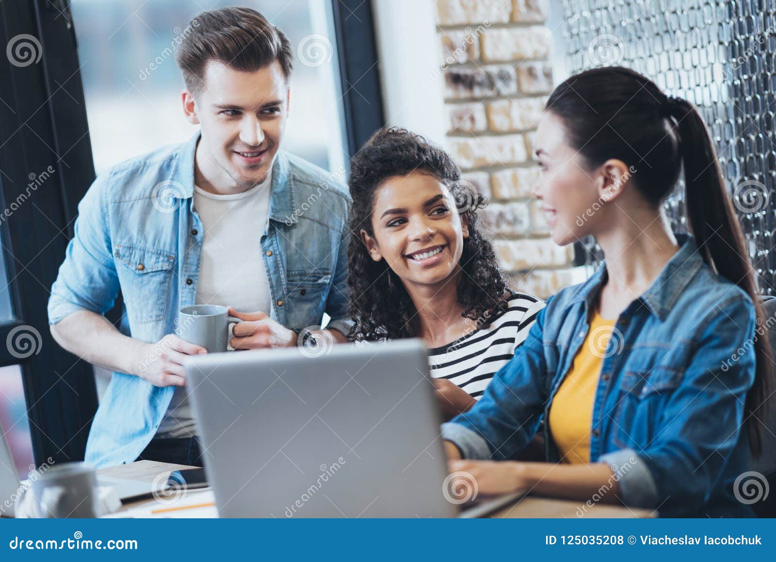 Enthusiastic Three Students Exchanging Ideas Stock Photo - Image of ...