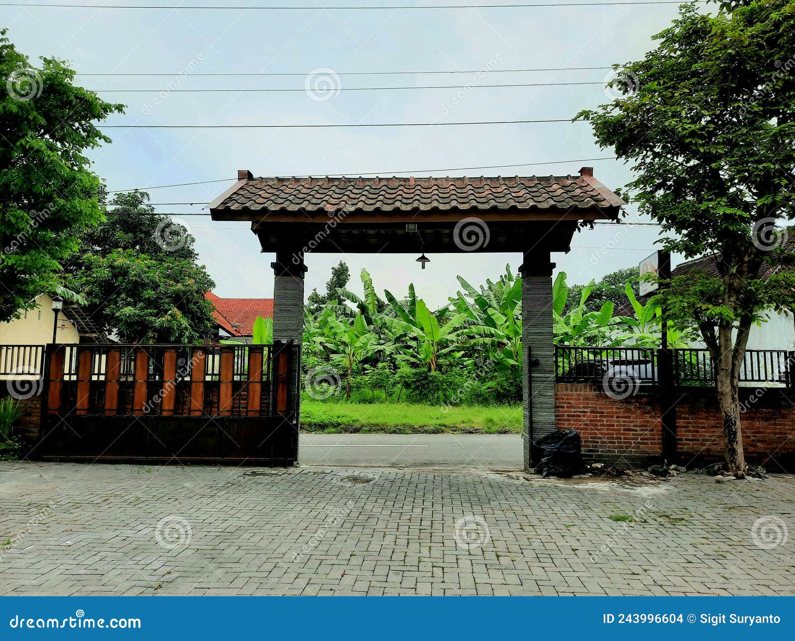 The Entrance Gate To the Front Yard of the House in Traditional Style ...