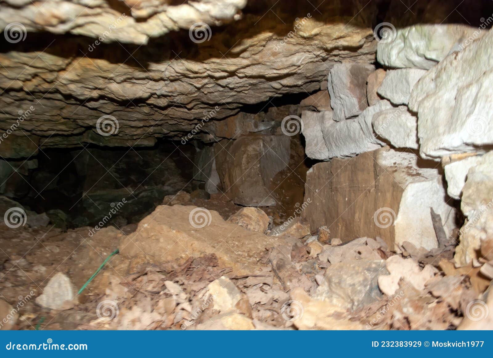 Entrance to a small cave stock image. Image of earth - 232383929