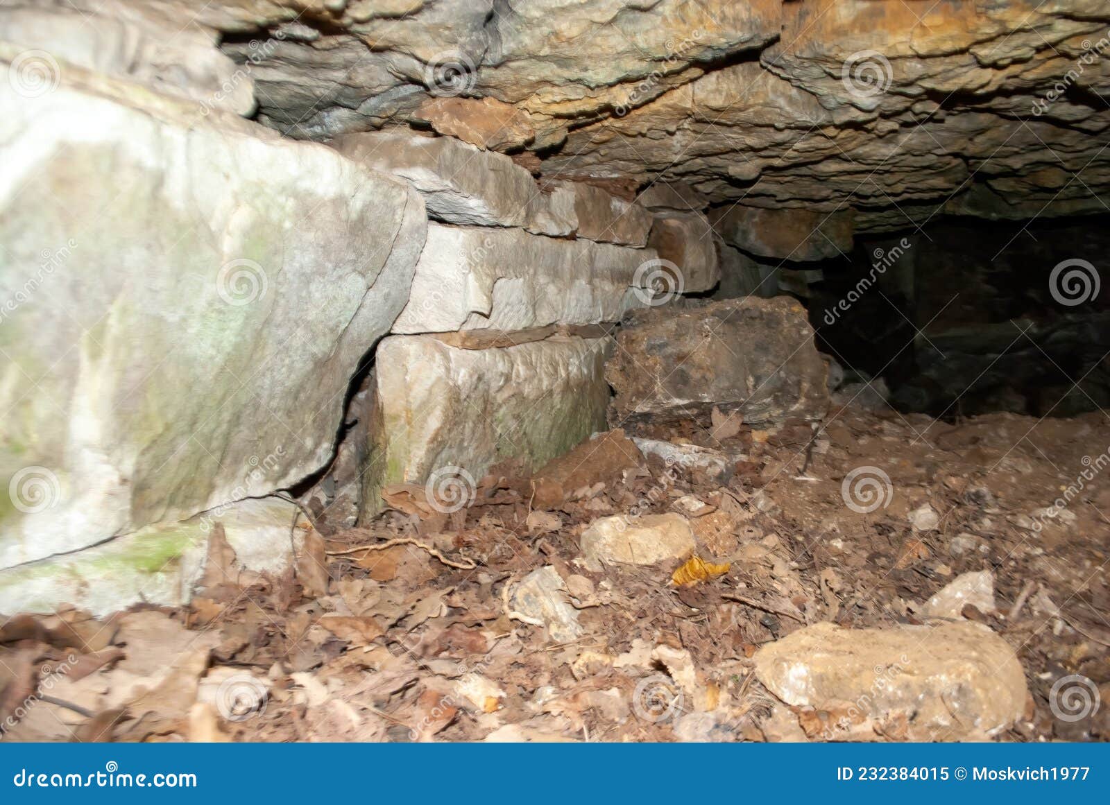 Entrance to a small cave stock image. Image of entrance - 232384015