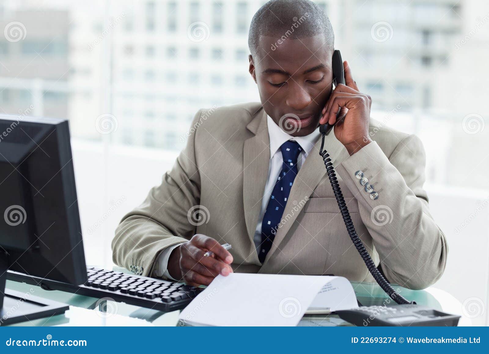 Entrepreneur Making a Phone Call while Reading a Document Stock Photo ...