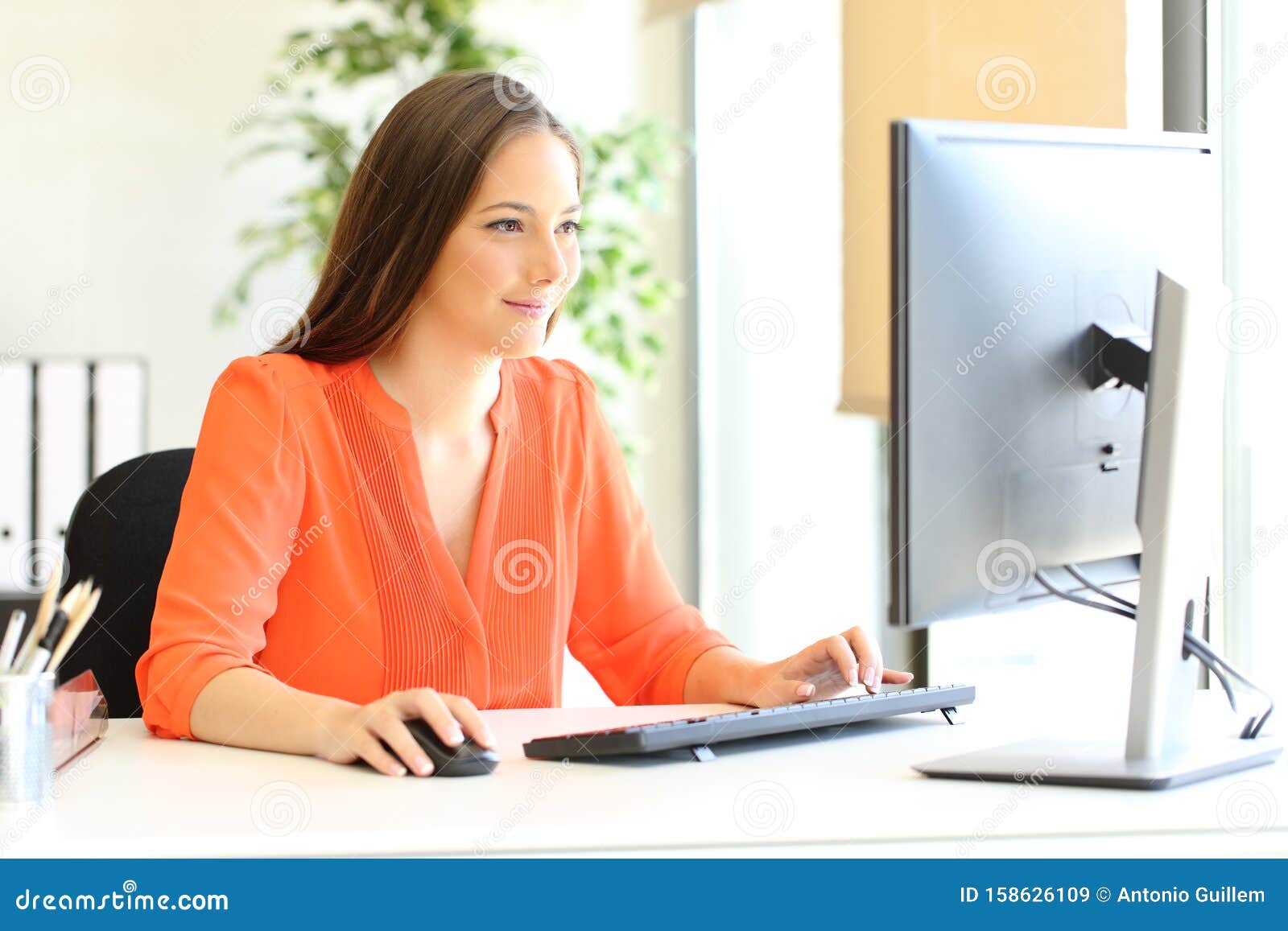 Entrepreneur in Orange Working with Desktop Computer Stock Image ...