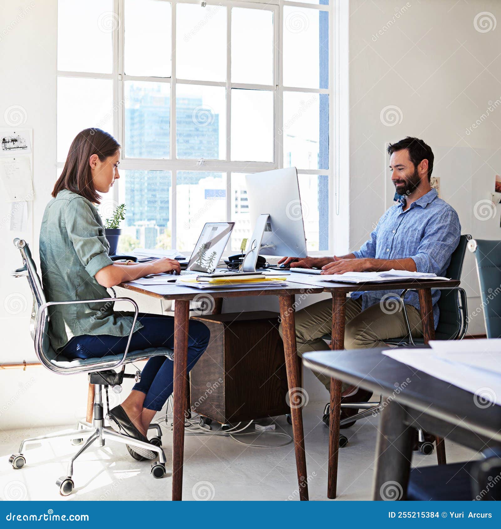 Entrepreneurs Hard at Work. Colleagues Working on Their Computers at a ...