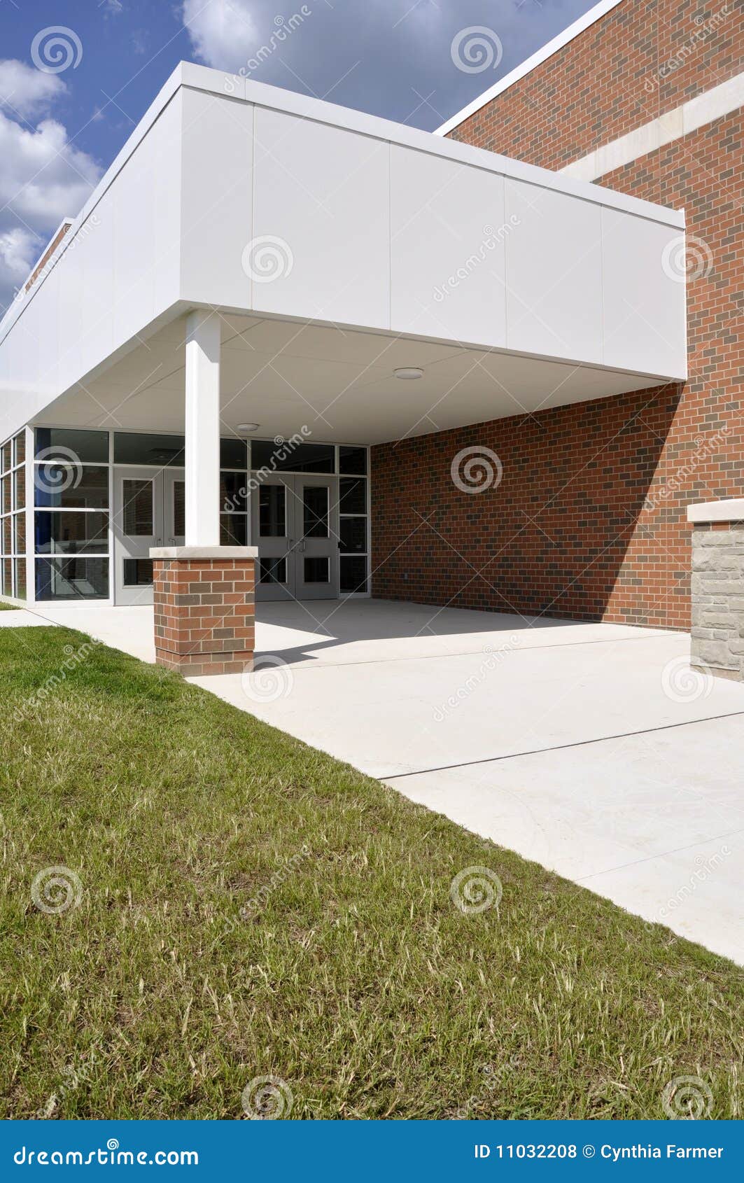Entry Doors and Sidewalk by a School Stock Photo - Image of entrance ...