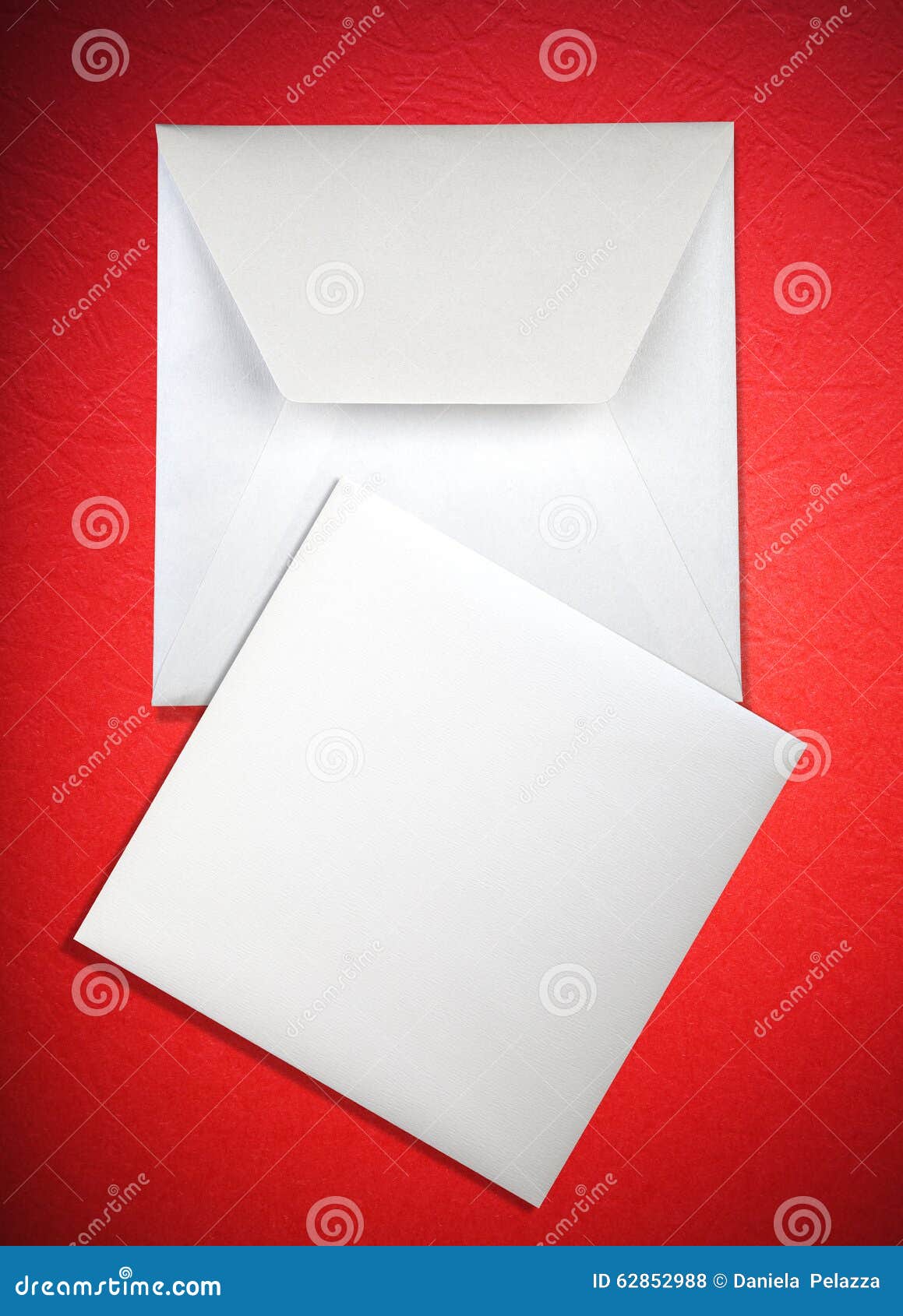 Envelope and card on red stock photo. Image of information - 62852988