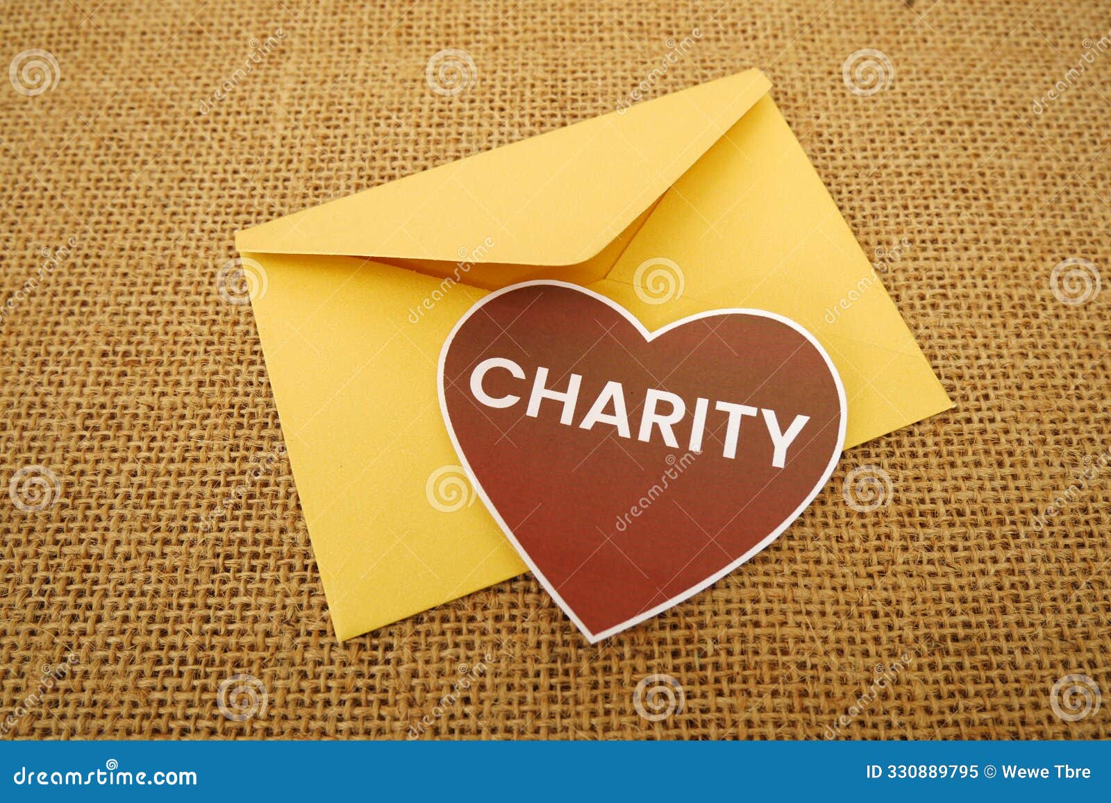 An Envelope with a Heart Marked Charity on a Burlap Table. Stock Image ...