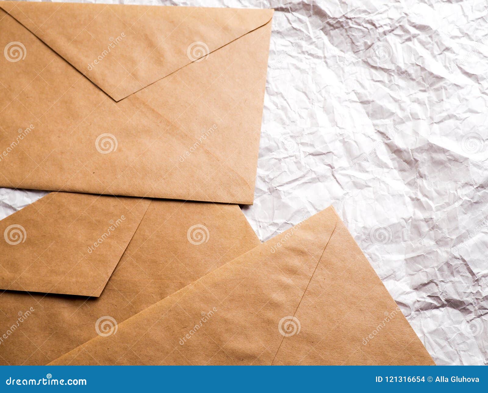 Envelope of Kraft Paper Lies on Crumpled Paper. Stock Photo - Image of ...