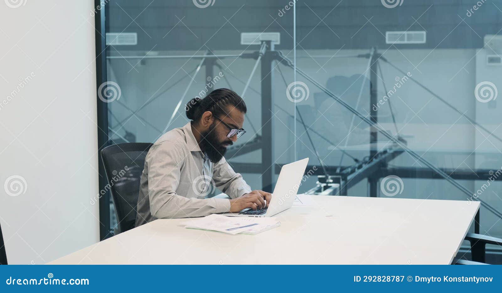 Indian Office Professional Typing on Laptop in Contemporary Workspace ...