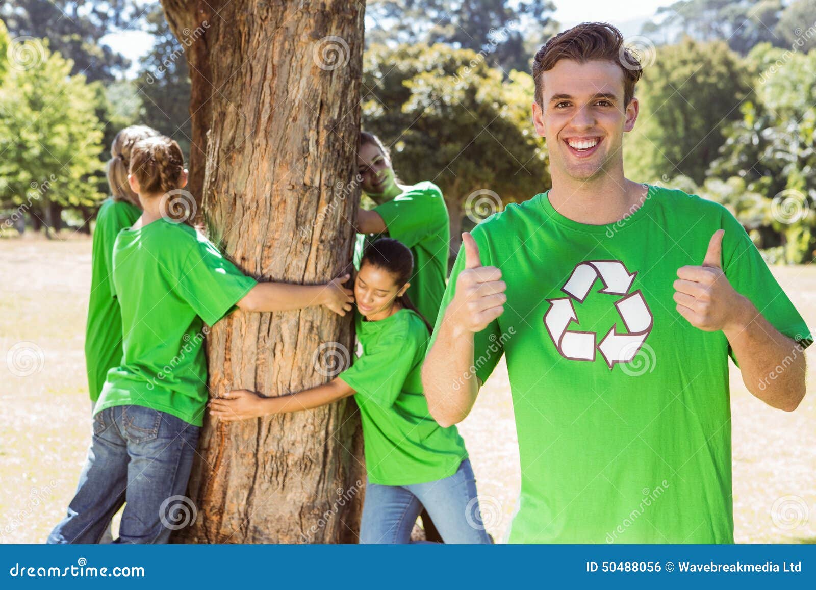 Environmental Activists Hugging a Tree in the Park Stock Photo - Image ...