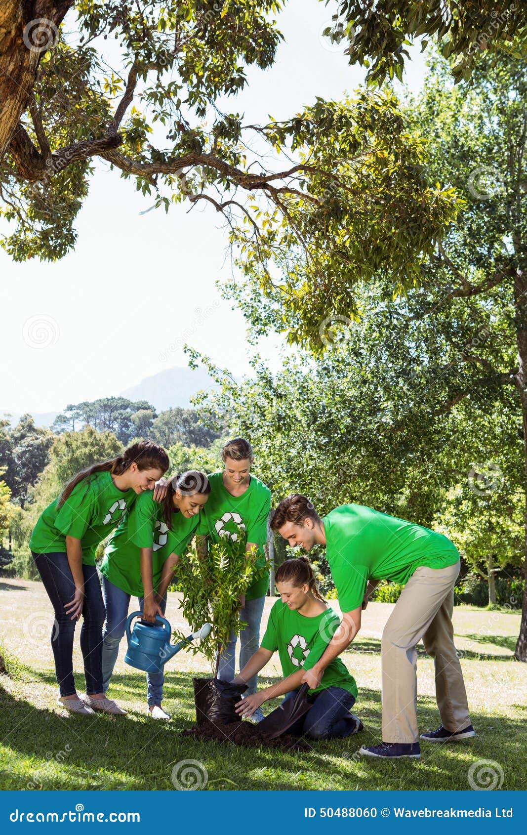 Environmental Activists Planting a Tree in the Park Stock Photo - Image ...