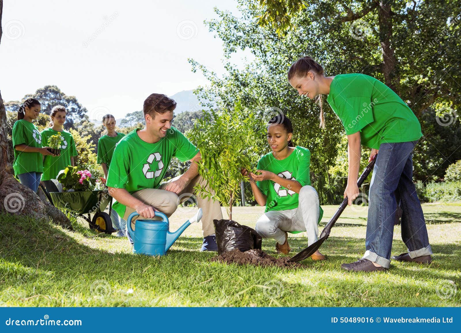 Environmental Activists Planting a Tree in the Park Stock Photo - Image ...