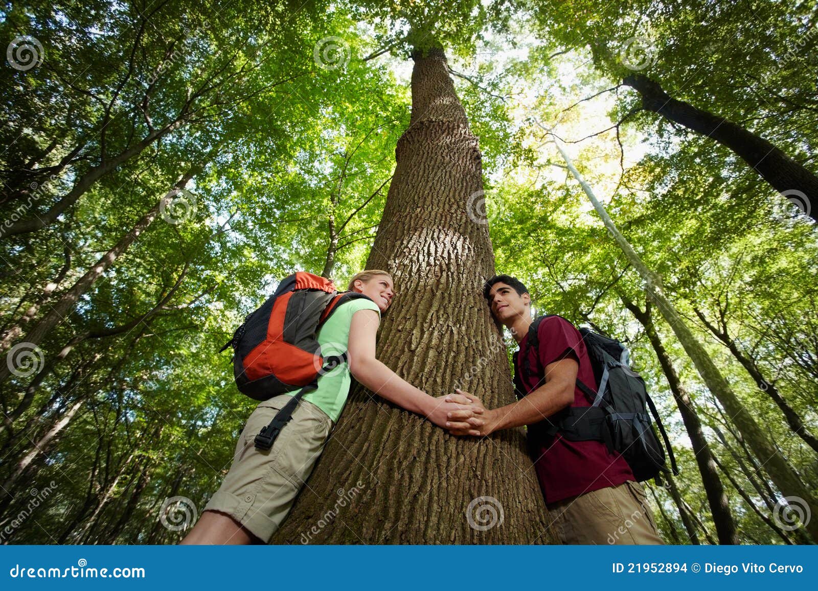 Environmental Conservation: Hikers Embracing Tree Stock Photo - Image ...