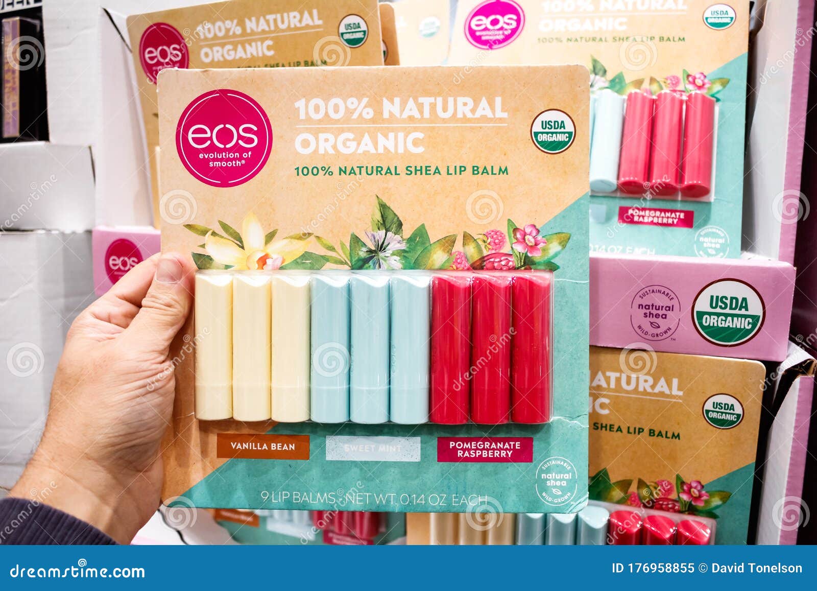 EOS lip balm editorial image. Image of hand, shop, holds - 176958855