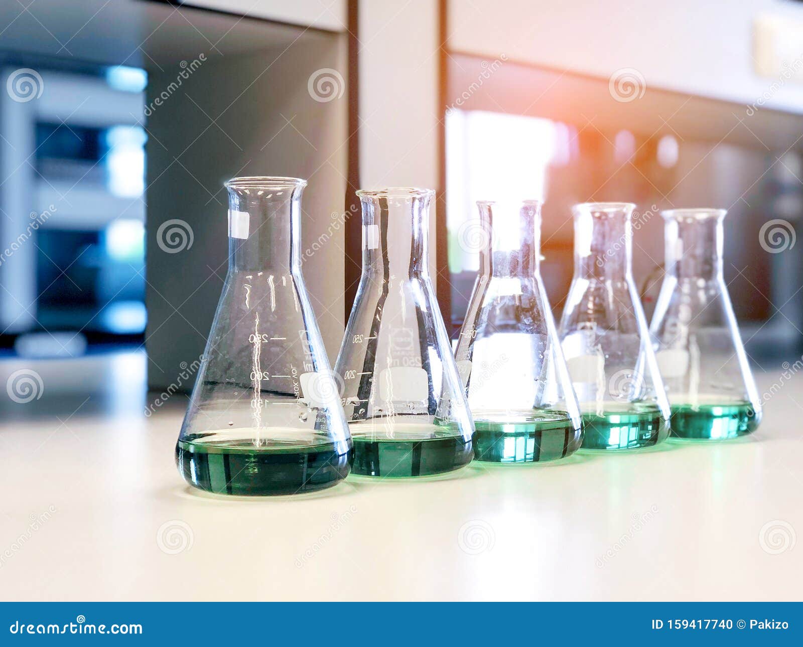 Conical Flasks With Red Liquid On Background. Laboratory Glassware ... Conical Flasks With Red Liquid On Background. Laboratory Glassware ...