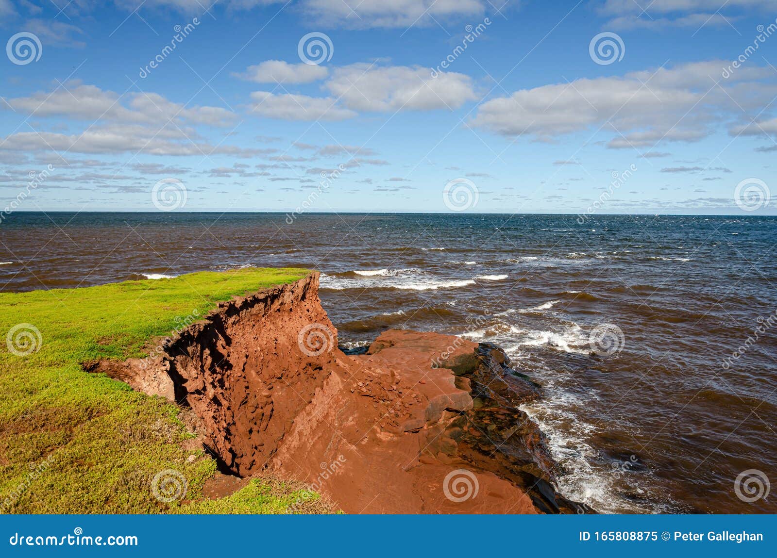 Erosion Red Rocks Falling into the Ocean on Pei Island Stock Image ...