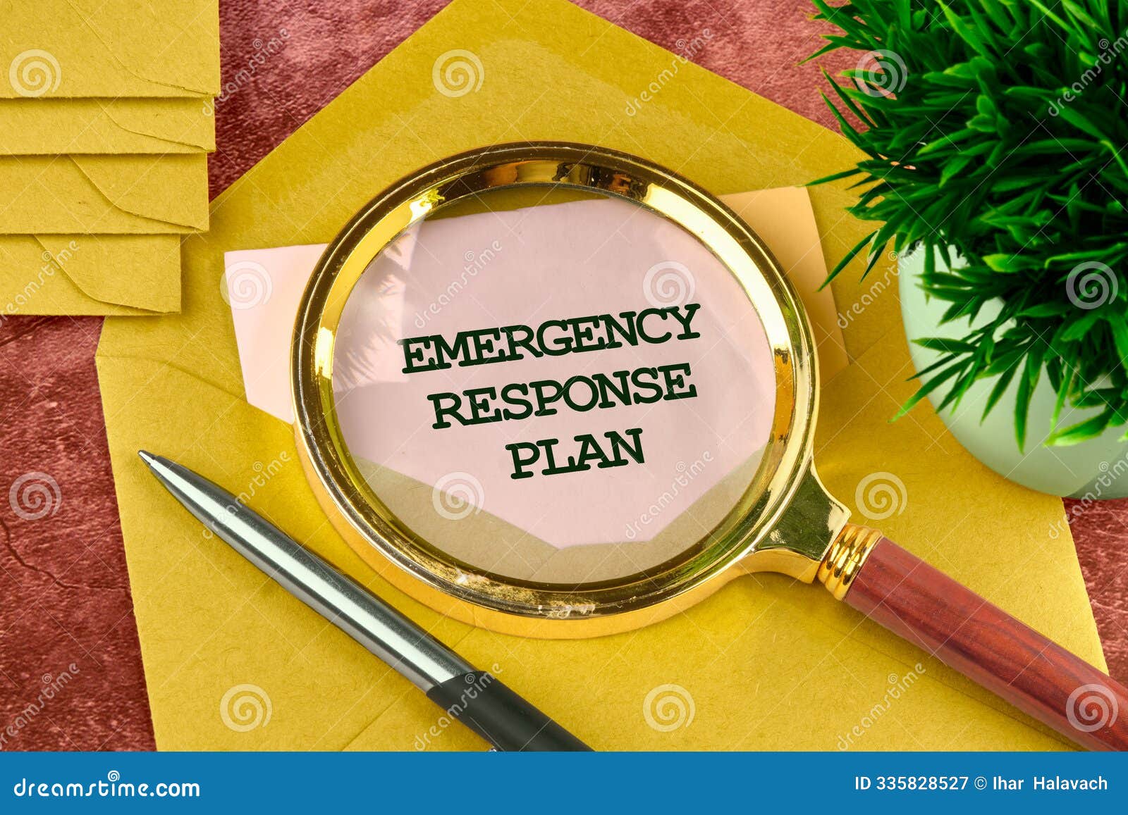 ERP As EMERGENCY RESPONSE PLAN Written on a Piece of Paper from an Envelope through a Magnifying ...