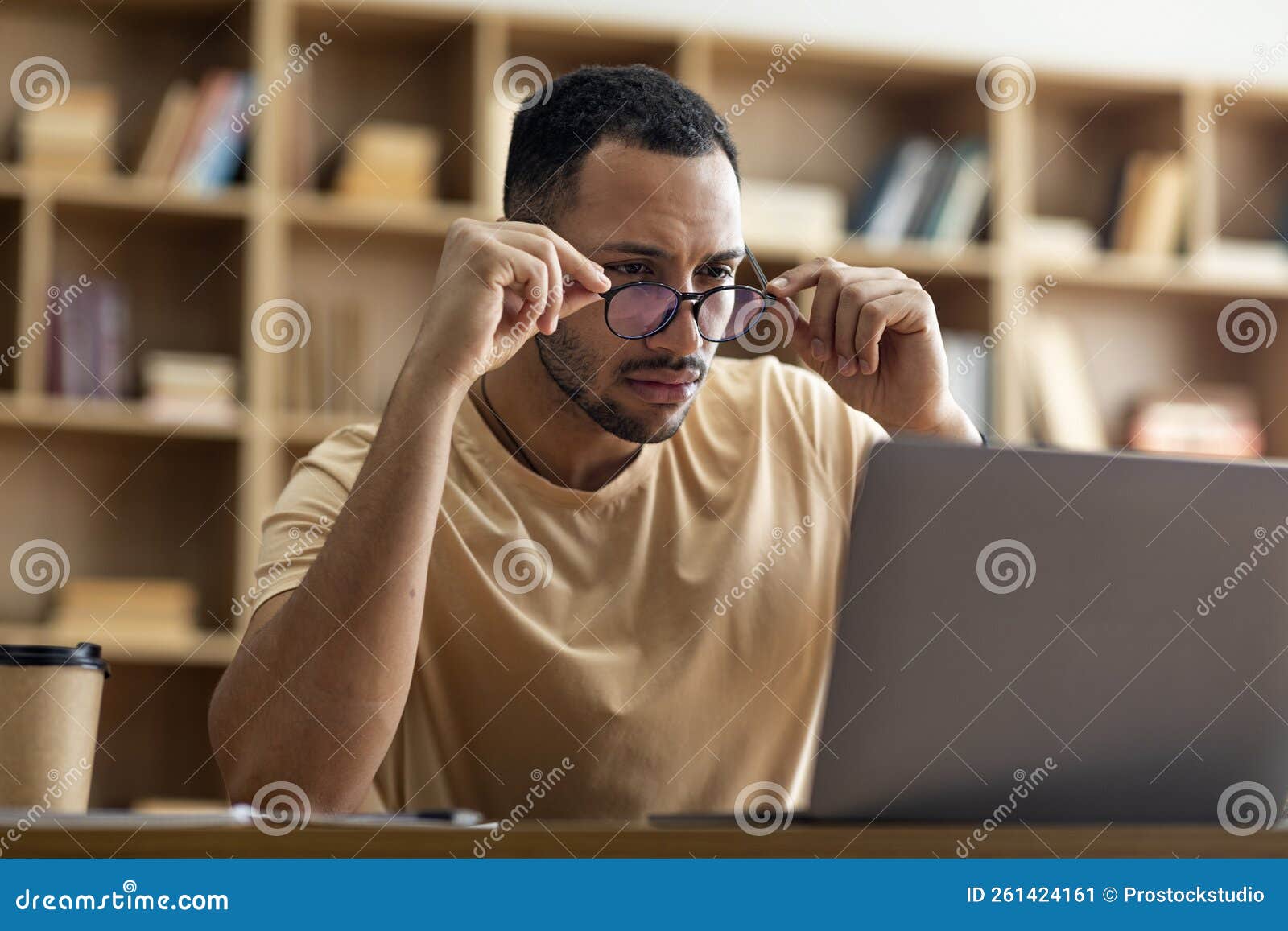 Error. Serious Arab Guy Sitting at Desk Using Laptop, Taking Off ...