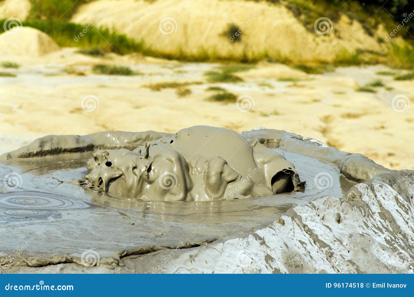 Erupting mud volcano stock photo. Image of phenomena - 96174518