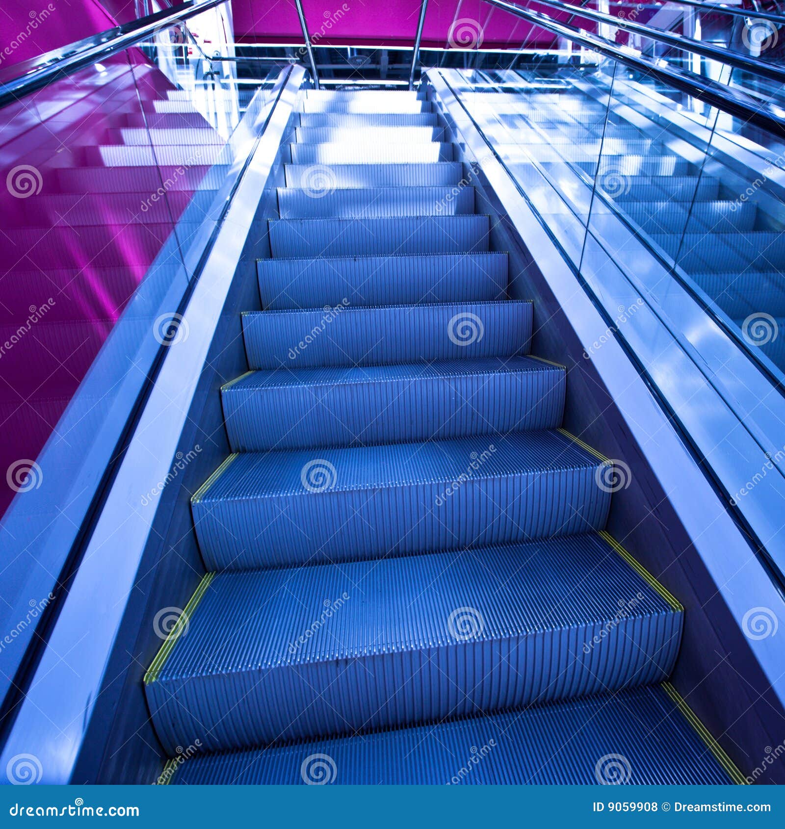 Escalator in blue corridor stock photo. Image of column - 9059908