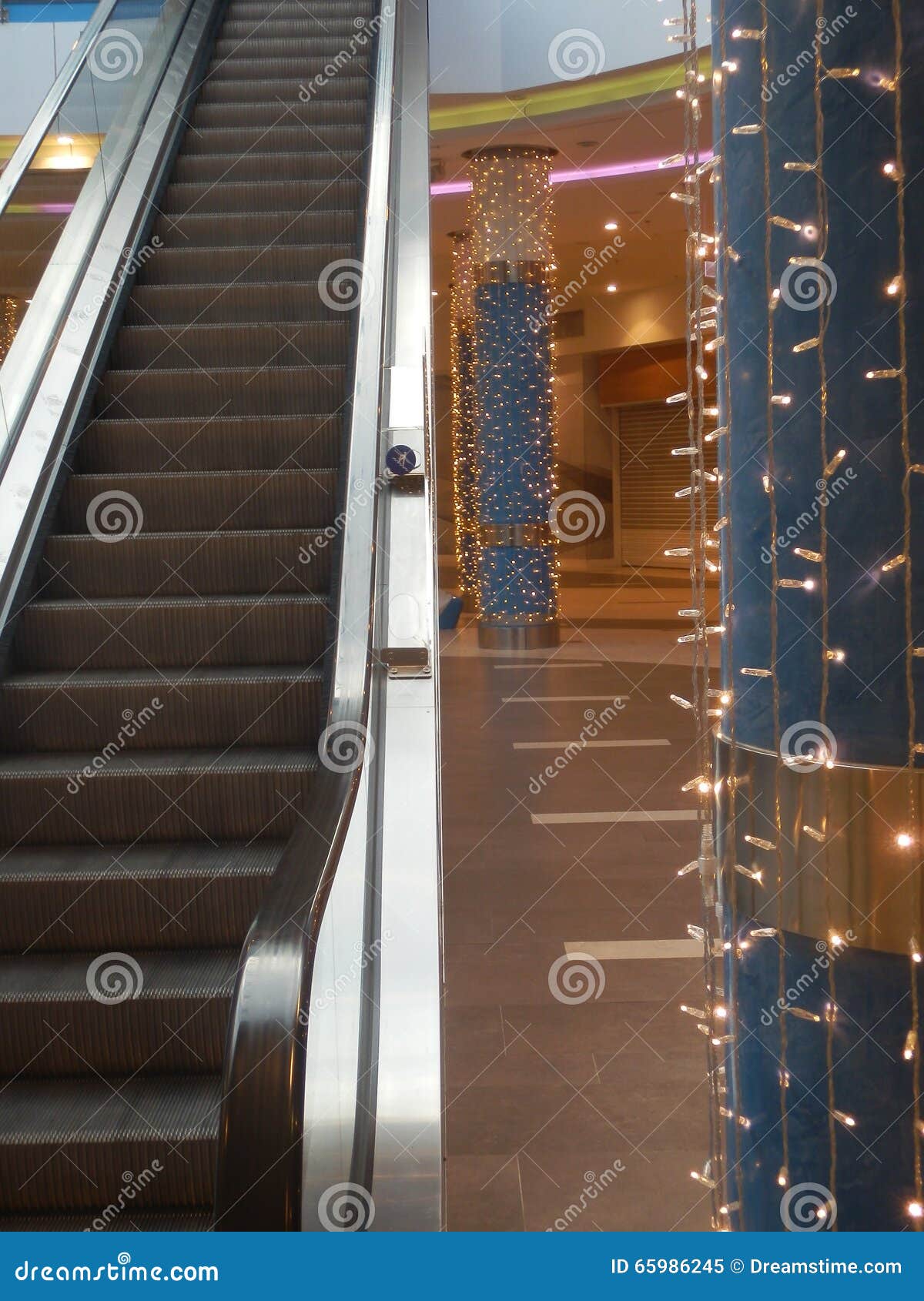 Escalator and Decorated Support Pillars Stock Image - Image of blue ...